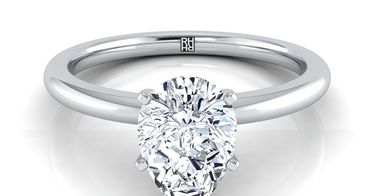 Platinum Pear Shape Center Round Comfort Fit Claw Prong Solitaire Enga